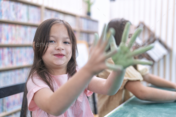 Children in class room happy laughing enjoy chalk drawing on green ...