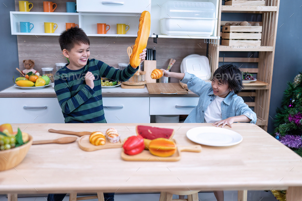 Children in learning kitchen room playing use fake bread and wooden ...