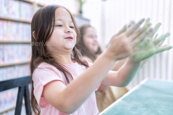 Children in class room happy laughing enjoy chalk drawing on green ...
