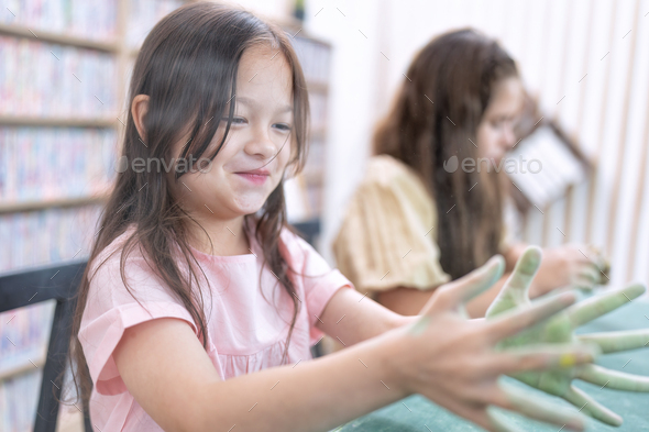 Children in class room happy laughing enjoy chalk drawing on green ...