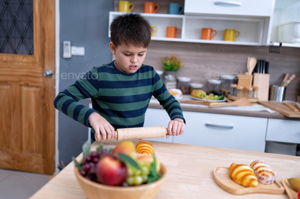 Children in learning kitchen room playing use wooden cooking pin roll ...