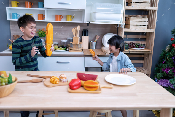Children in learning kitchen room playing use fake bread and wooden ...