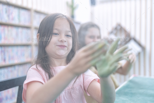Children in class room happy laughing enjoy chalk drawing on green ...