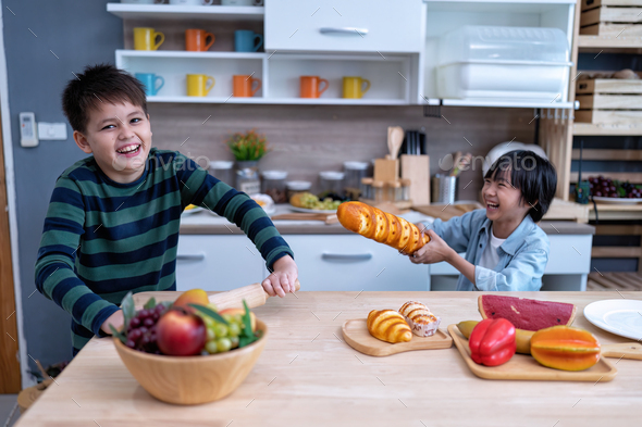 Children in learning kitchen room playing use fake bread and wooden ...