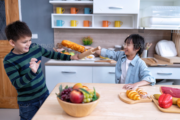 Children in learning kitchen room playing use fake bread and wooden ...