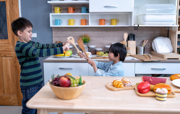 Children in learning kitchen room playing use fake bread and wooden ...