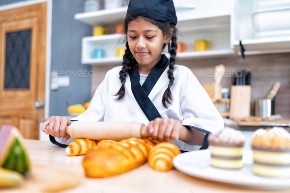 Children in learning kitchen room playing use fake bread and wooden ...