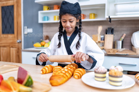 Children in learning kitchen room playing use fake bread and wooden ...