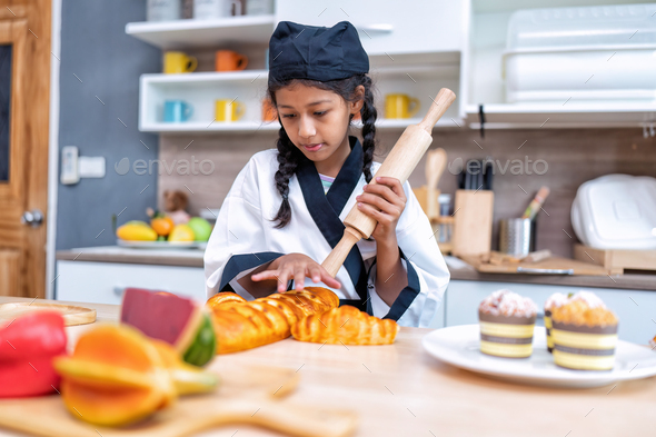 Children in learning kitchen room playing use fake bread and wooden ...