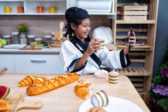 Children in learning kitchen room use mobile phone video call learn ...