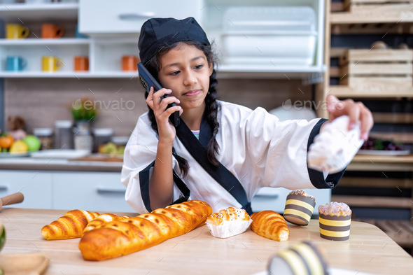 Children in learning kitchen room use mobile phone video call learn ...