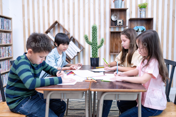 Children in class room happy laughing enjoy draw picture on paper and ...