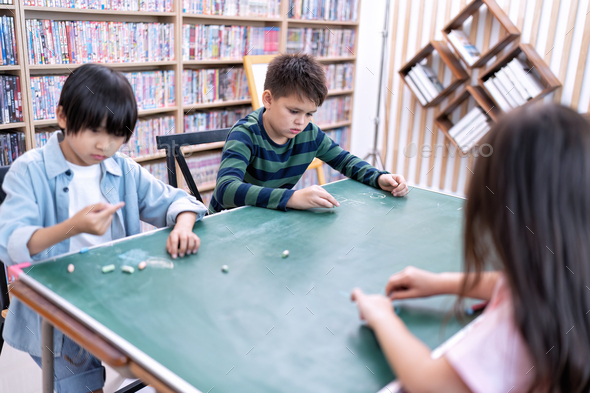 Children in class room happy laughing enjoy draw picture on green board ...