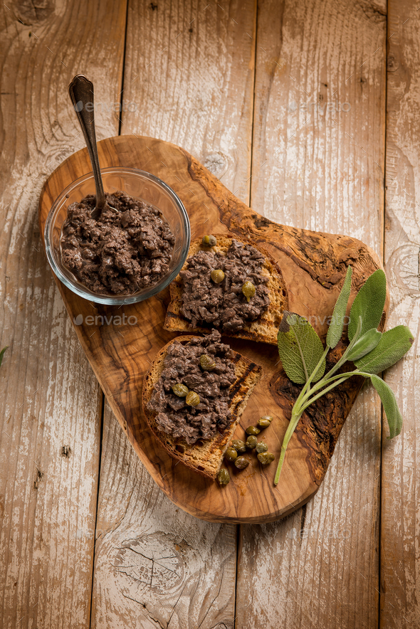 rostini with capers traditional tuscany appetizer Stock Photo by MarcoMayer