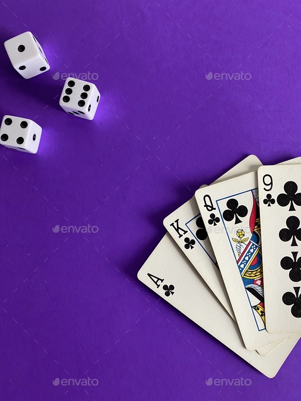 Playing cards with dice on purple background Stock Photo by melpaul199