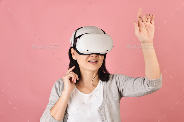 Asian woman using vr glasses, Hand grabbing something from virtual ...