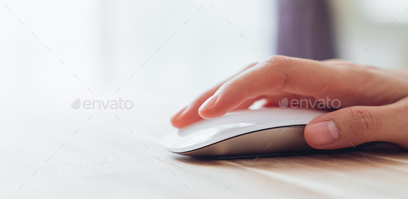 Close up of hand using on white mouse and clicking on office table ...