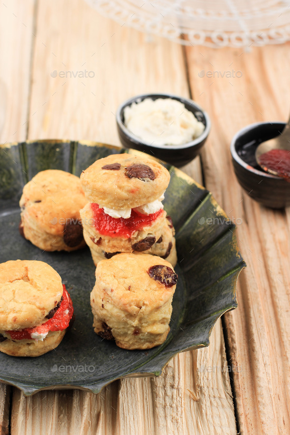 Mini Round Scones with Strawberry Jam and Clotted Cream Stock Photo by ...