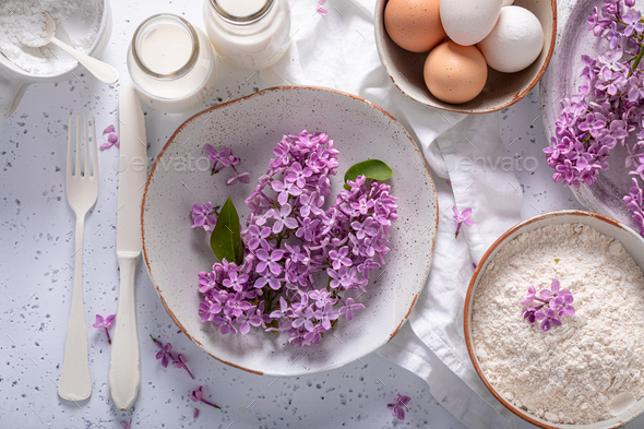 Preparation for fried lilac flower with powdered sugar. Sweet dessert ...