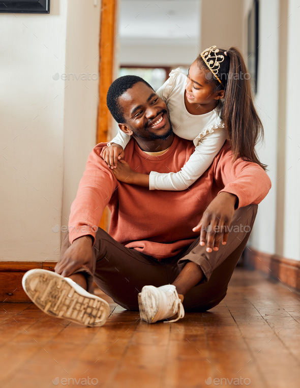 Family, father and daughter hug in their home, happy and relax while ...