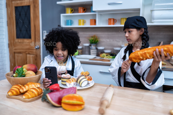 Children in learning kitchen room use mobile phone video call learn ...