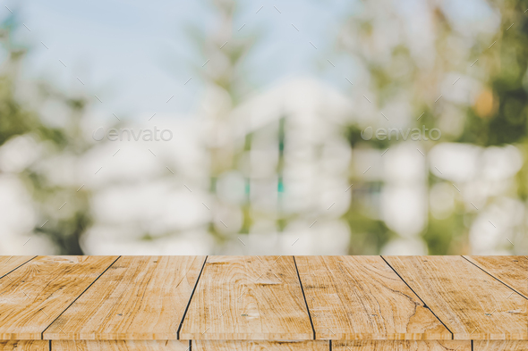 Wooden table space with green home backyard outdoor blur background for ...