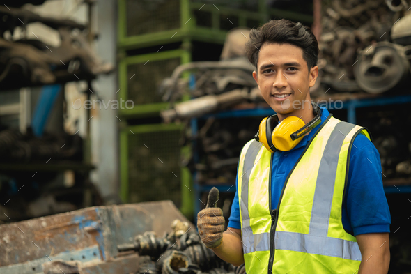 portrait Asian young male engineer staff worker foreman work in heavy ...