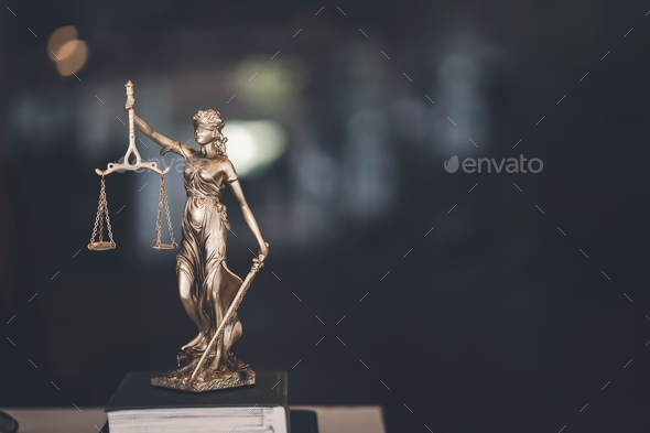 Statue of lady justice on desk of a judge or lawyer. Stock Photo by ...