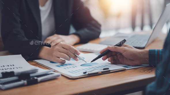 Group of business people meeting Point to the graph, study the company ...