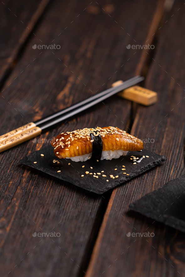 Japanese sushi unagi nigiri sushi smoked eel on wooden background close-up Stock Photo by Satura_