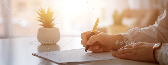 Woman's hands writing on sheet with a pen. Stock Photo by ...