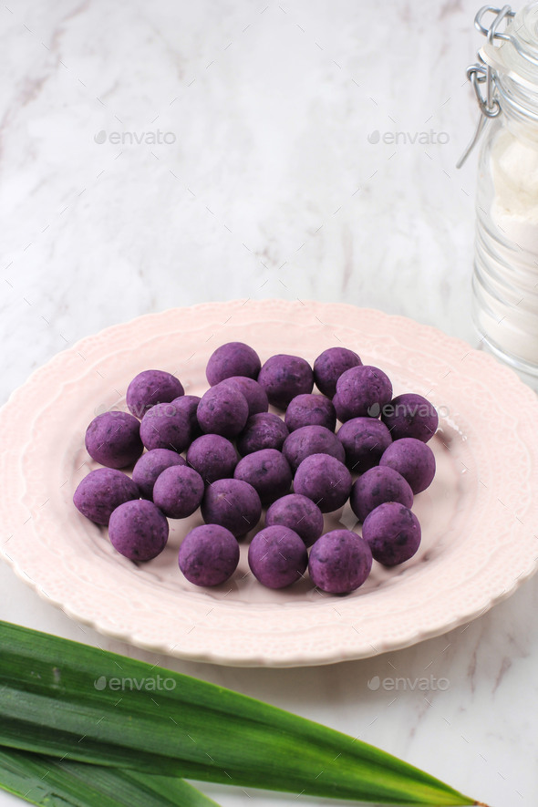 Female Indonesian Put Biji Salak Purple Sweet Potato Rice Cake (Candil Ubi Ungu) Stock Photo by ...