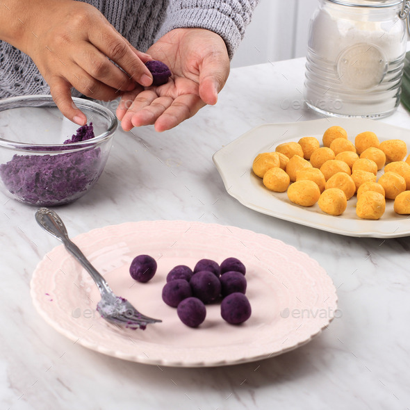 Female Indonesian Put Biji Salak Purple Sweet Potato Rice Cake (Candil Ubi Ungu) Stock Photo by ...
