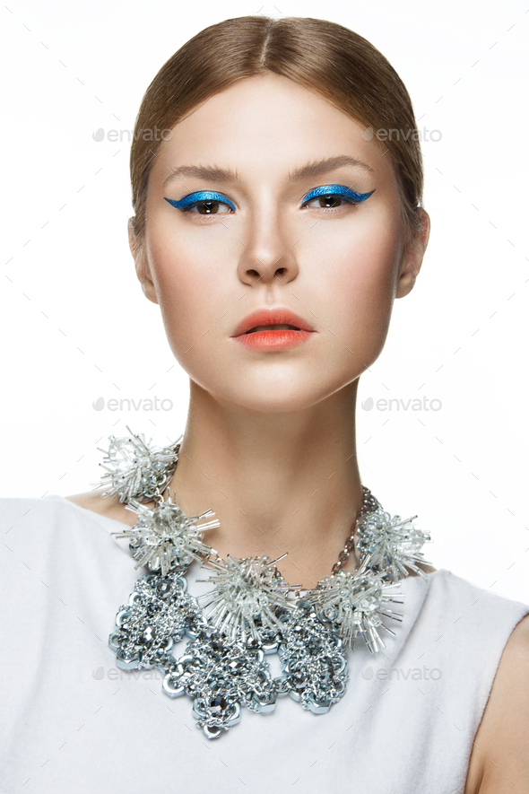 Beautiful fashionable girl with smooth hair and original decoration ...