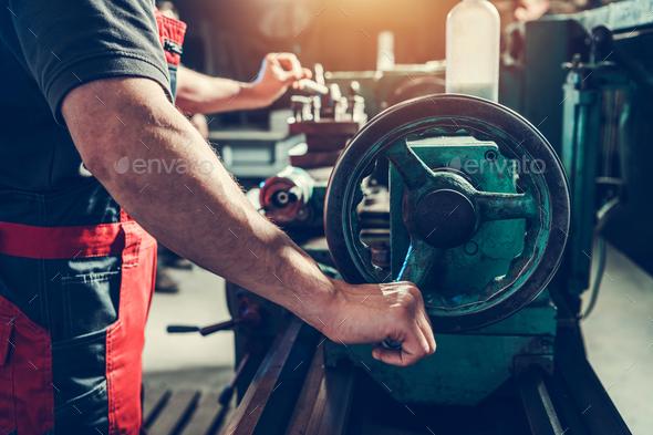Lathe Machine Operator Performing Machining Operations Stock Photo by ...