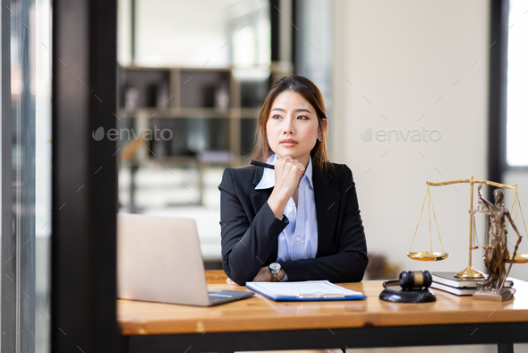 Business Asian woman in suit and Lawyer working on a documents at ...