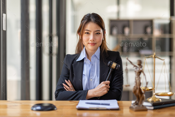 Business Asian woman in suit and Lawyer working on a documents at ...