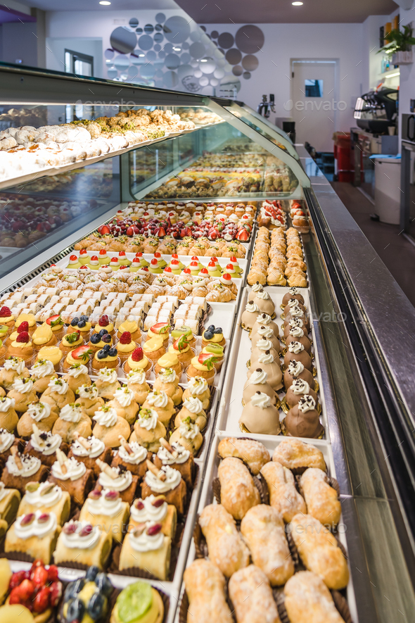 Italian Bakery counter, Window of desserts at a pastry shop. Fresh and ...