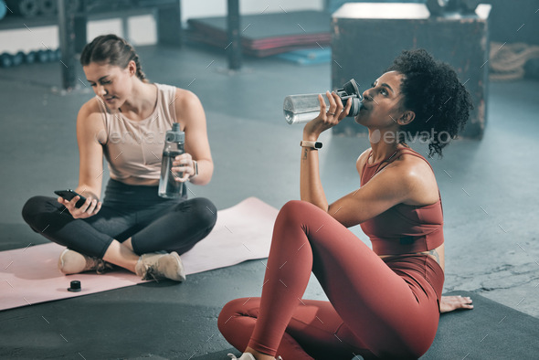 Fitness, relax and drinking water with women in gym for workout ...