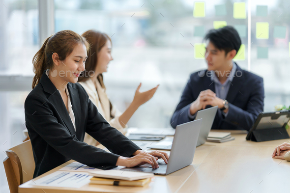 Group of young Asian business people with the creative work, talk and exchange new startup ...