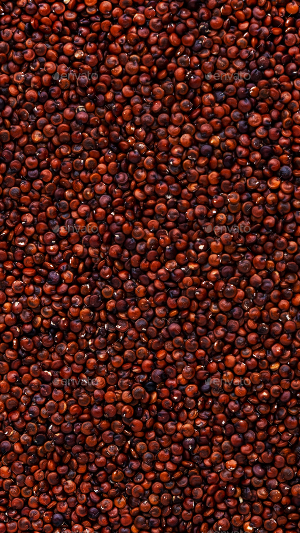 Raw red quinoa groats, food background texture, top view vertical ...