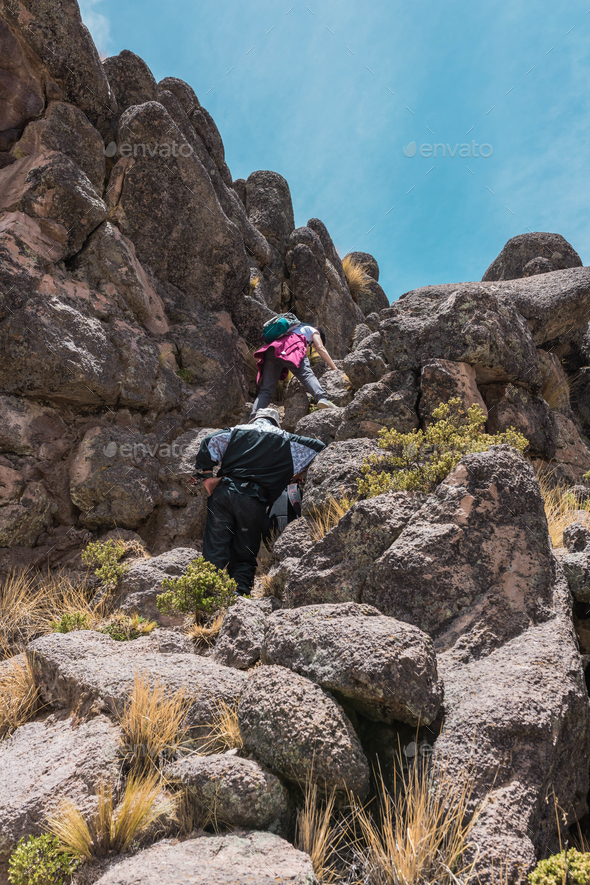 Hiking group climbing a rocky hill in Stone Forest of Imata, Arequipa ...