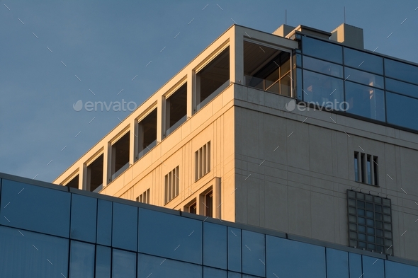 Modern building with blue glass windows under the sunlight during ...