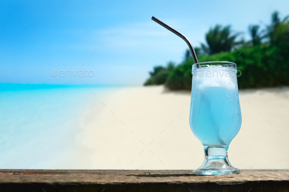 Blue Lagoon cocktail, bar on tropical Maldives beach. Summer alcoholic ...