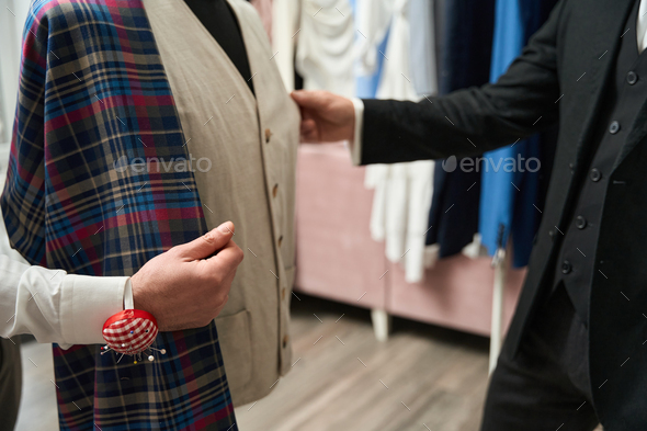 Tailor and customer selecting fabric for new piece of clothing Stock ...