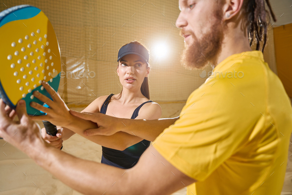 Man and woman learning how to properly hold beach tennis racket Stock ...