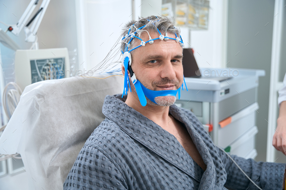 Man undergoes an EEG examination - electroencephalography in medical ...