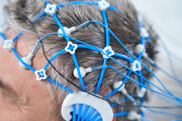Gray-haired man on the diagnosis of EEG - electroencephalography Stock ...