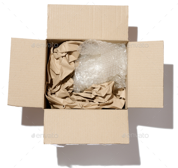 Open cardboard box, inside crumpled paper and polyethylene Stock Photo ...