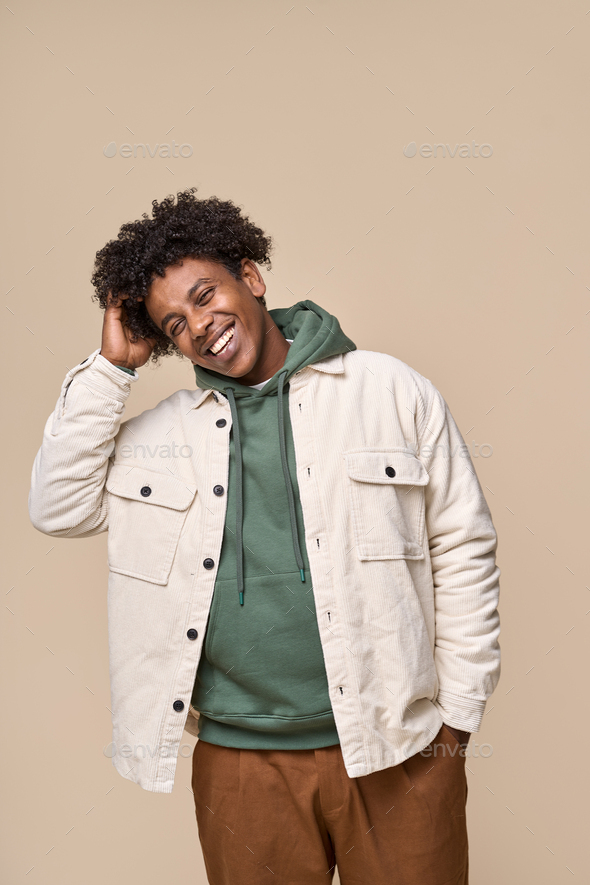 Happy cool African American gen z guy isolated on beige background ...